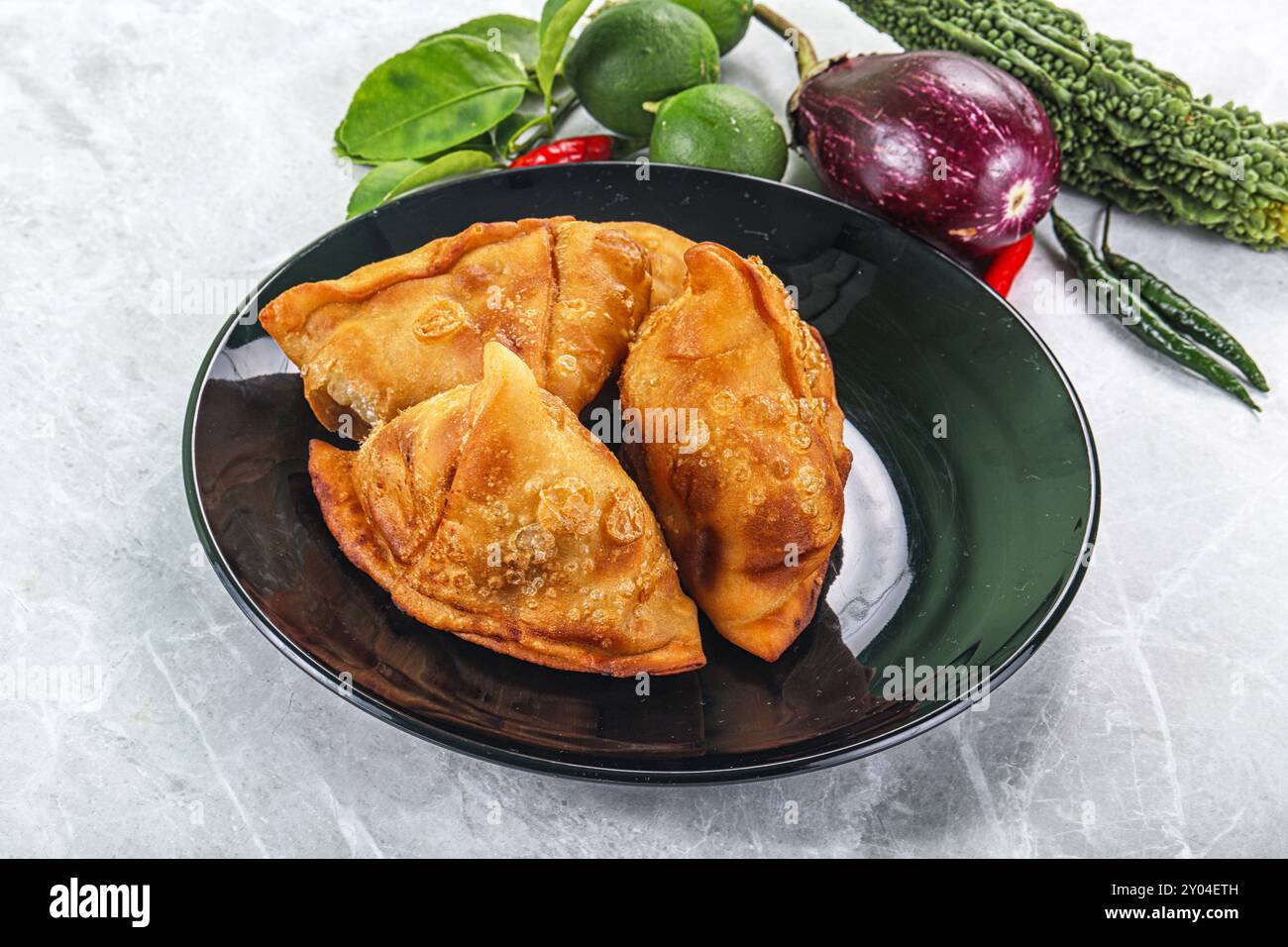 Indian cuisine - fries crispy stuffed samosa Stock Photo - Alamy