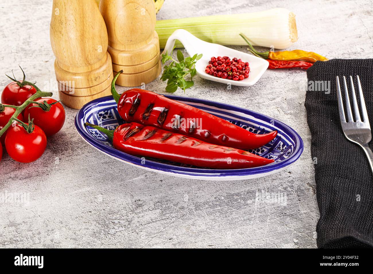 Grilled red spicy pepper snack in the bowl Stock Photo - Alamy