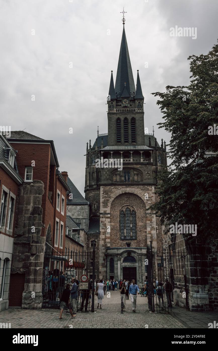 People - tourists and worshippers - outside the entrance to Aachen ...