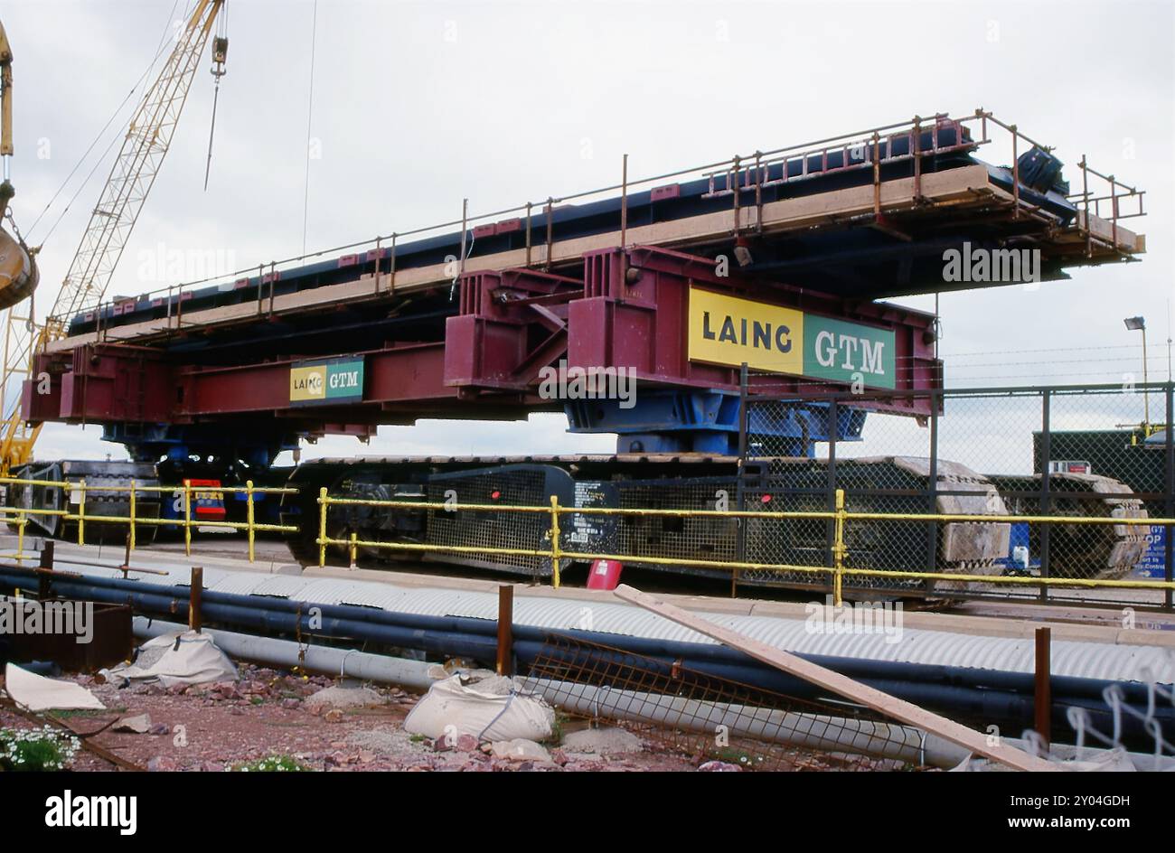The crawler vehicle was used to move the caissons out of the building ...