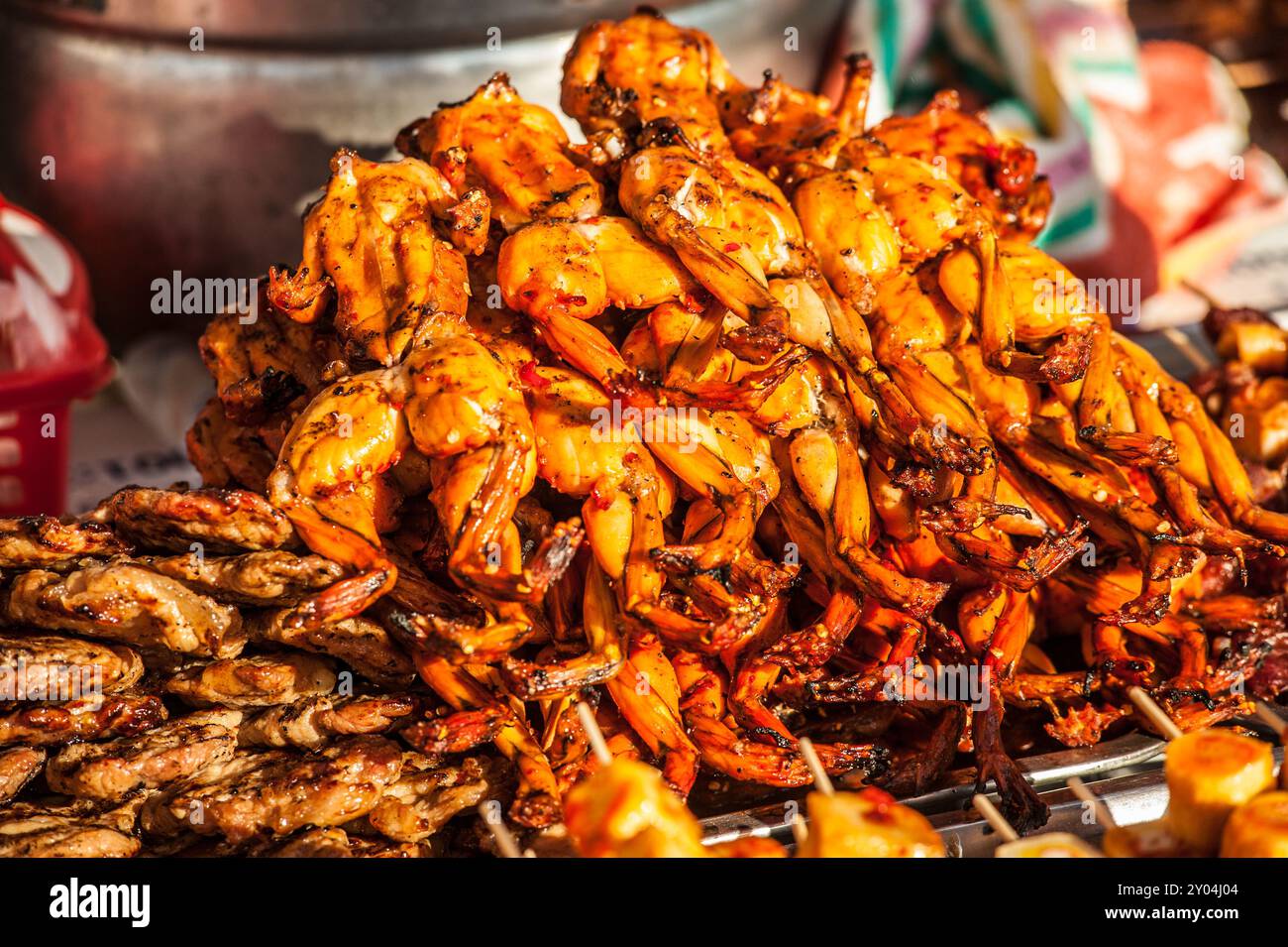 BBQ frogs for sale at a street stall during the Cambodian Water ...