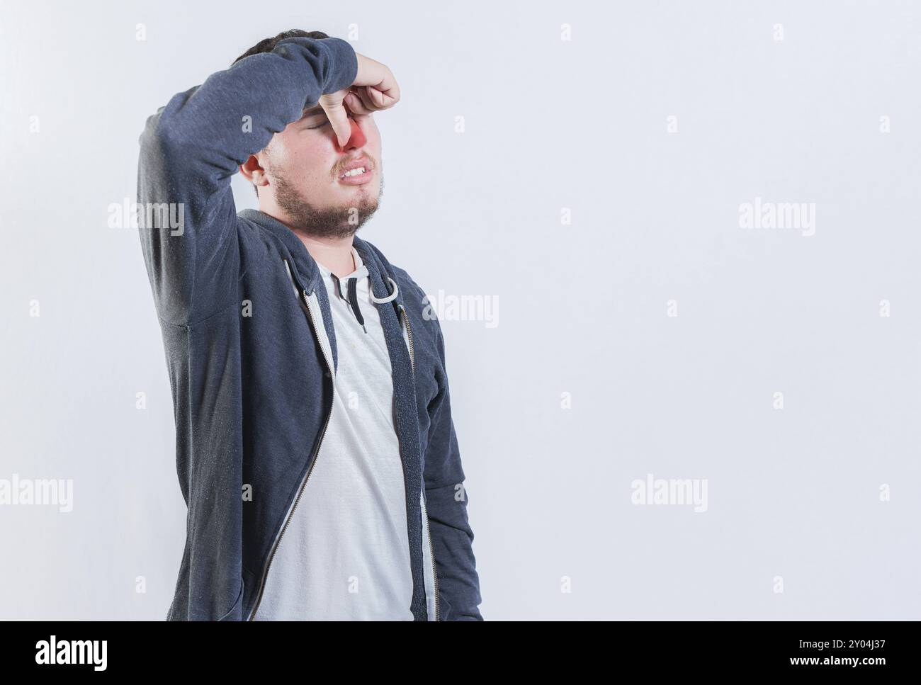 Suffering man with nasal bridge pain isolated. Guy suffering with nasal ...