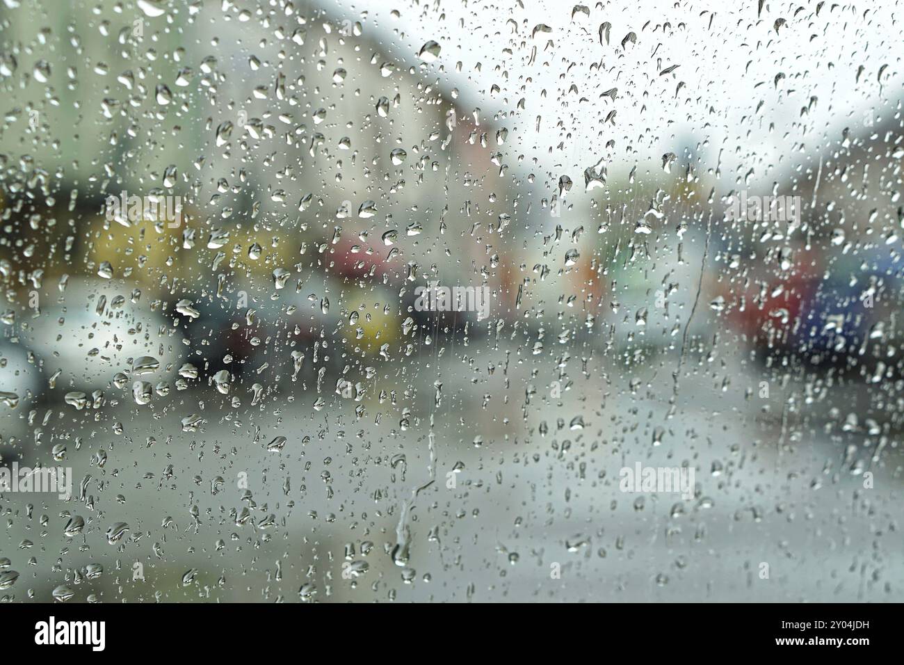 Rainy day abstract weather photo trough wet window Stock Photo - Alamy