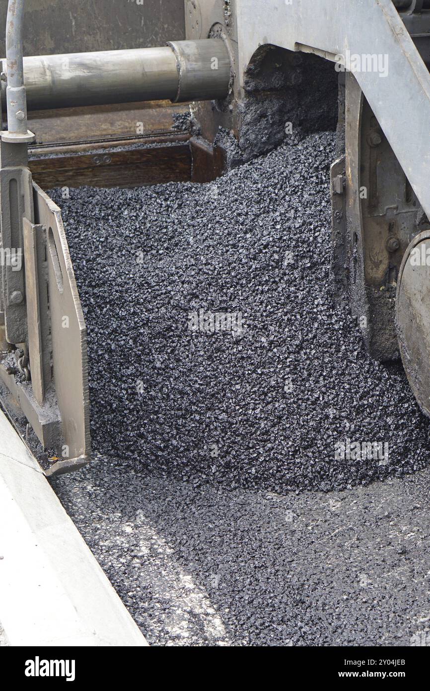 Paving street with asphalt road works with surfacing machine Stock ...