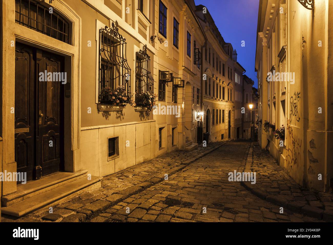 City of Bratislava in Slovakia at night, narrow cobblestone street in ...
