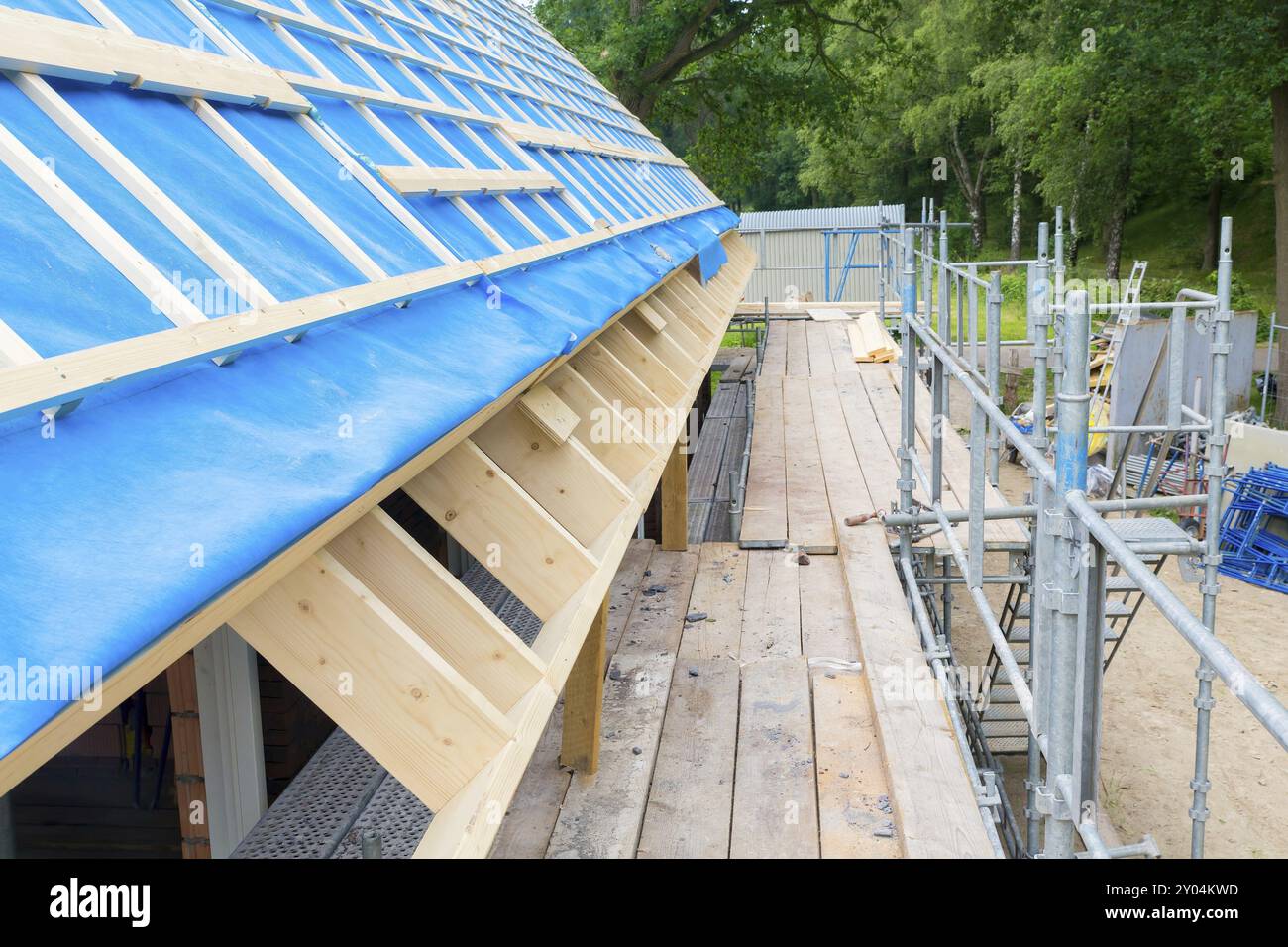 Wooden scaffolding next to roof of new home on construction site Stock ...
