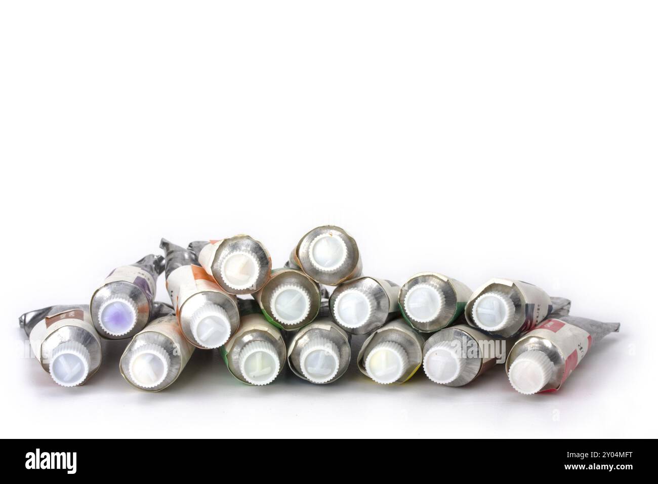 A lot of paint tubes on white background Stock Photo - Alamy