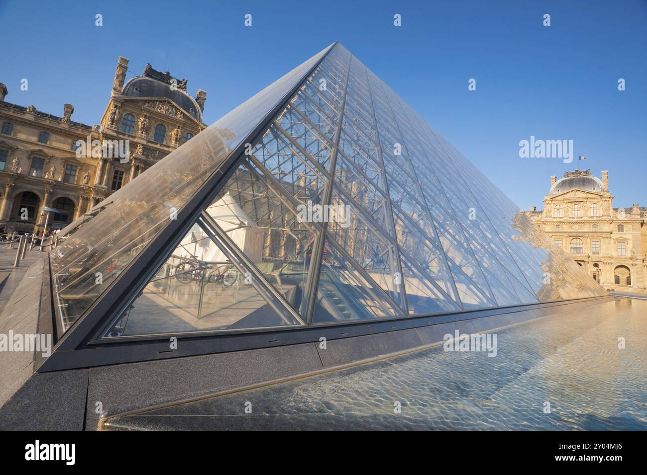 A close tilted view of the Louvre Pyramid, the entrance to the Louvre ...