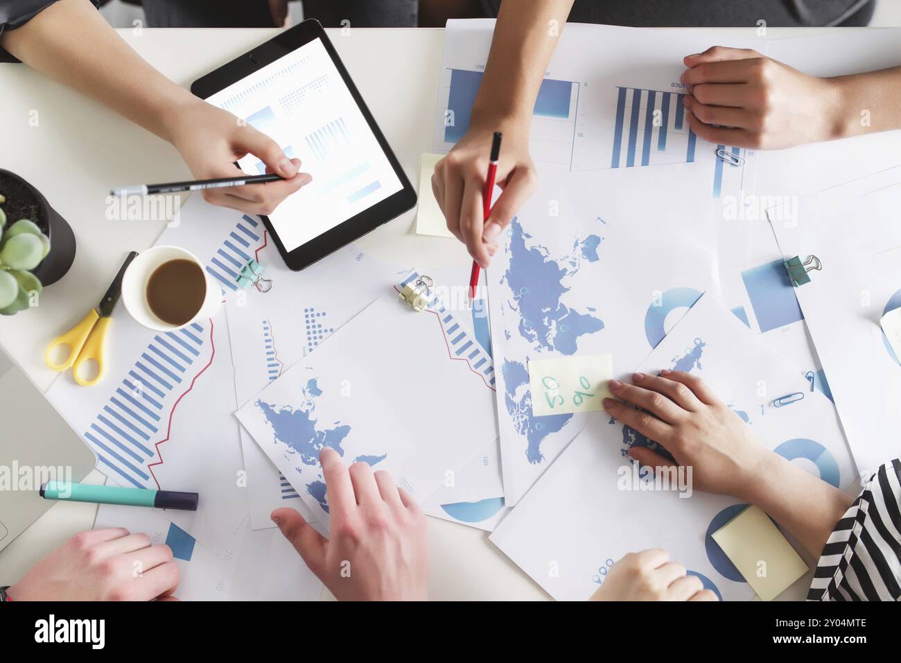 Business planning process with colleagues or partners sitting together ...