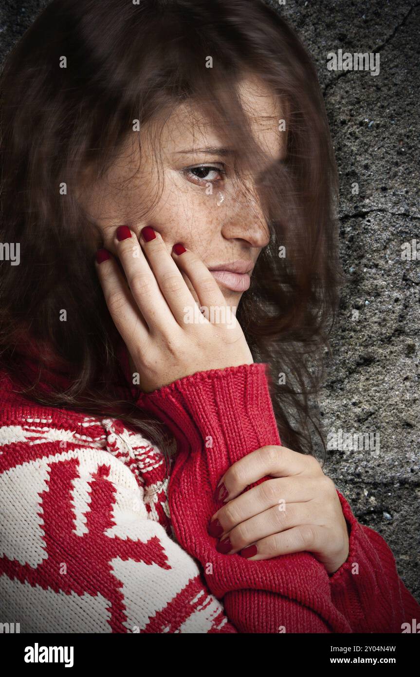 Sad woman crying, hair flying, dark background Stock Photo - Alamy