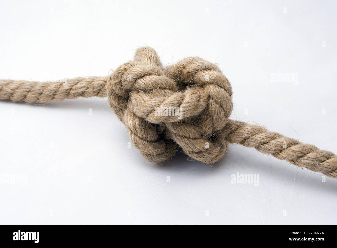 Tied up rope knot isolated on white background Stock Photo - Alamy