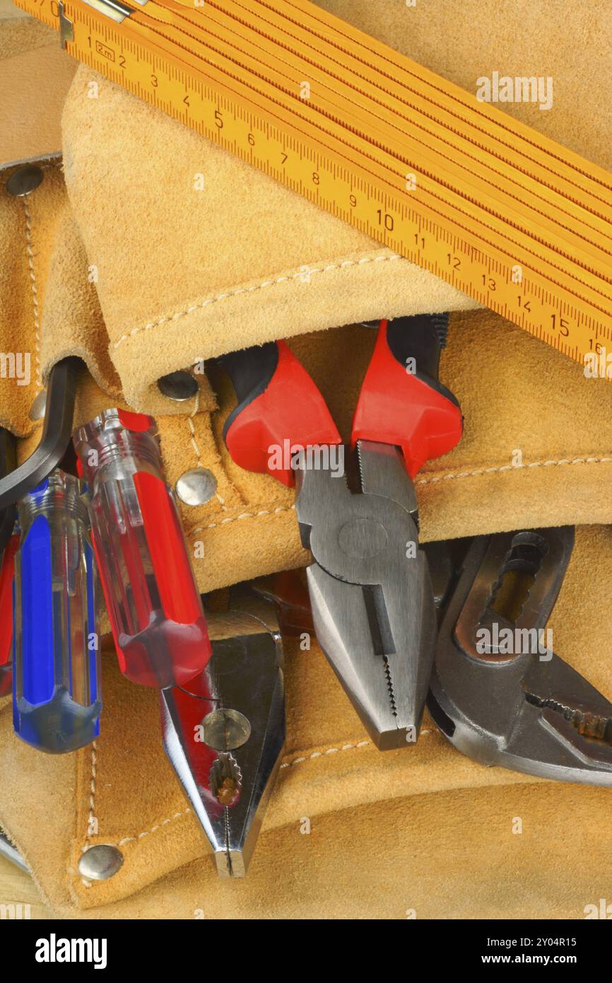 Manual worker tool set with some screwdrivers, metric ruler, pipe ...