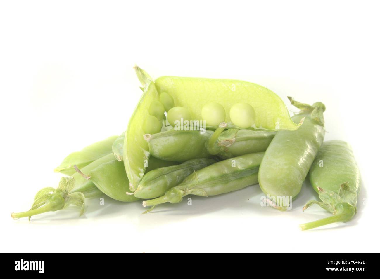 Sugar snap peas against a white background Stock Photo - Alamy