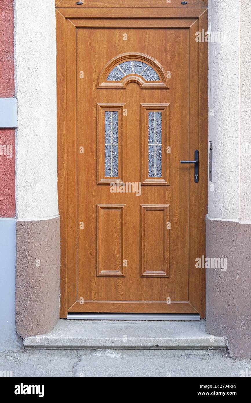 Brown wood door with big transom light window Stock Photo - Alamy