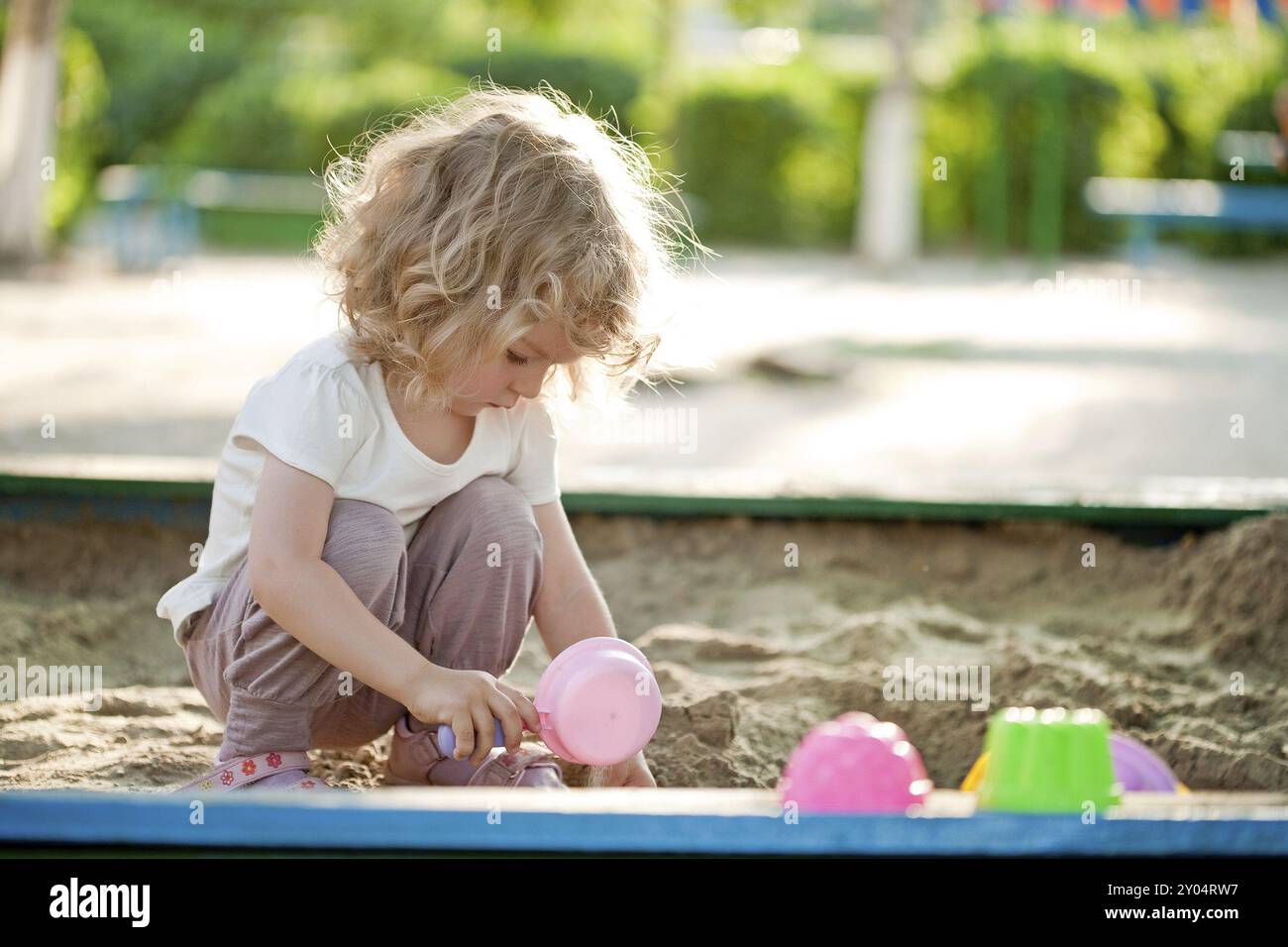 Child on playground in summer park Stock Photo - Alamy
