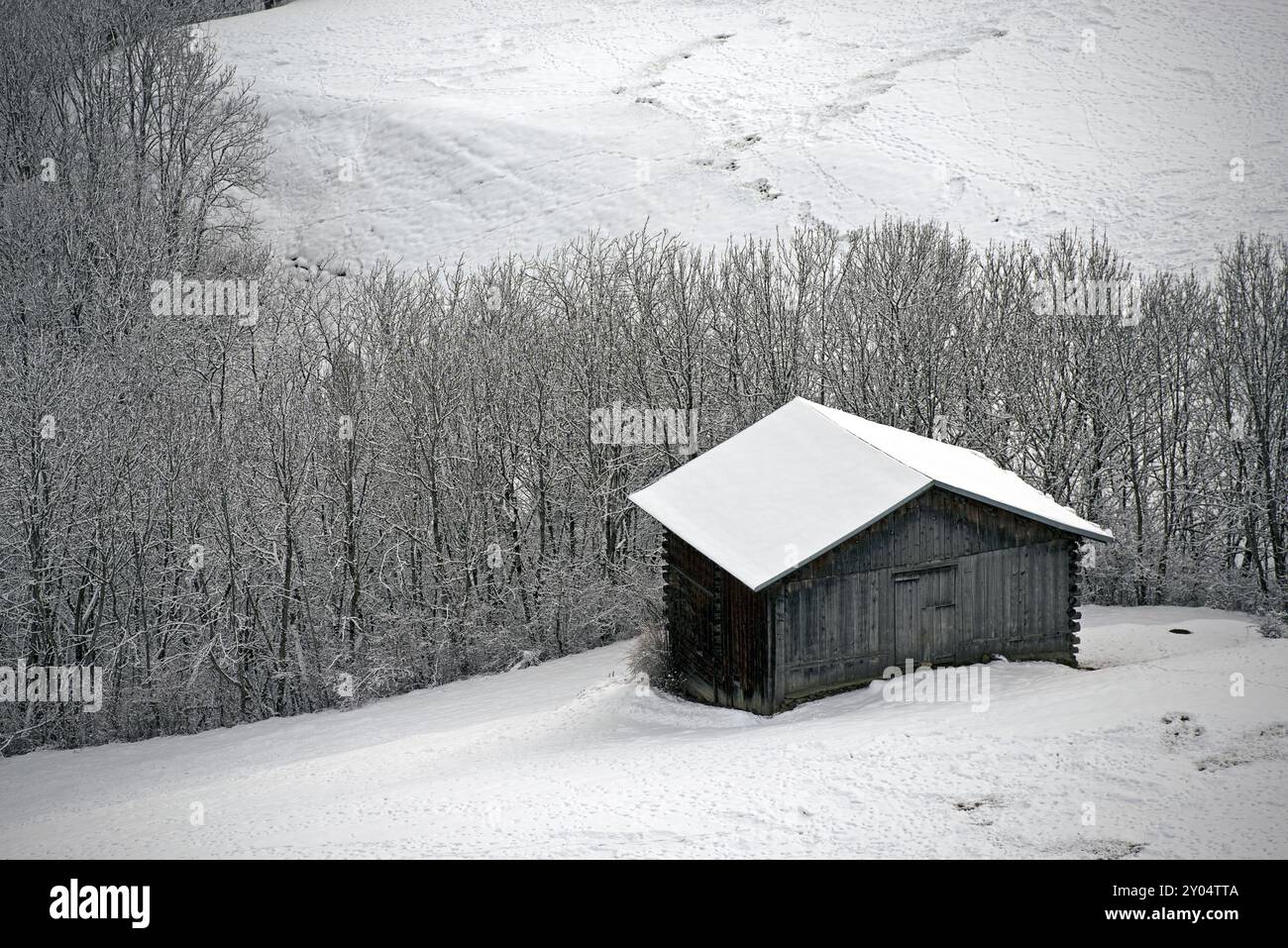 Wooden hut in a winter landscape Stock Photo - Alamy
