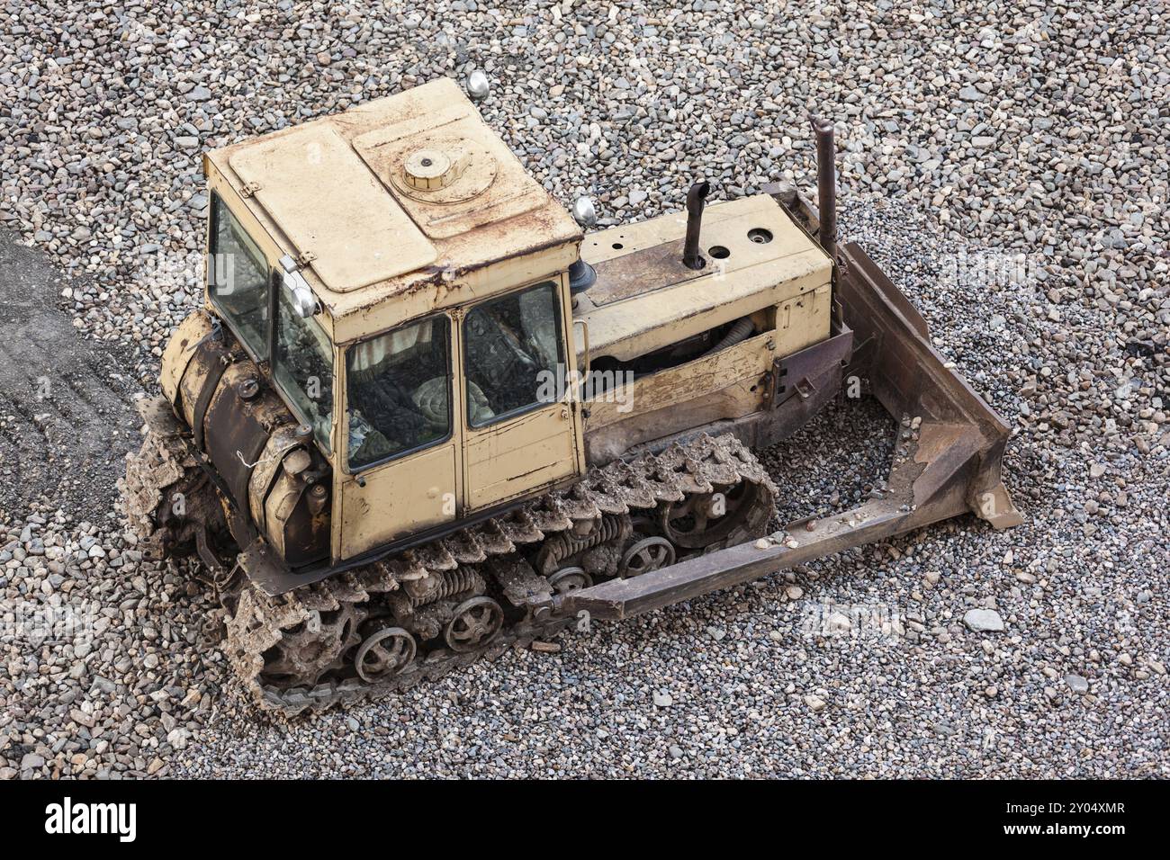 Old rusty earth digging caterpillar bulldozer machine working at ...