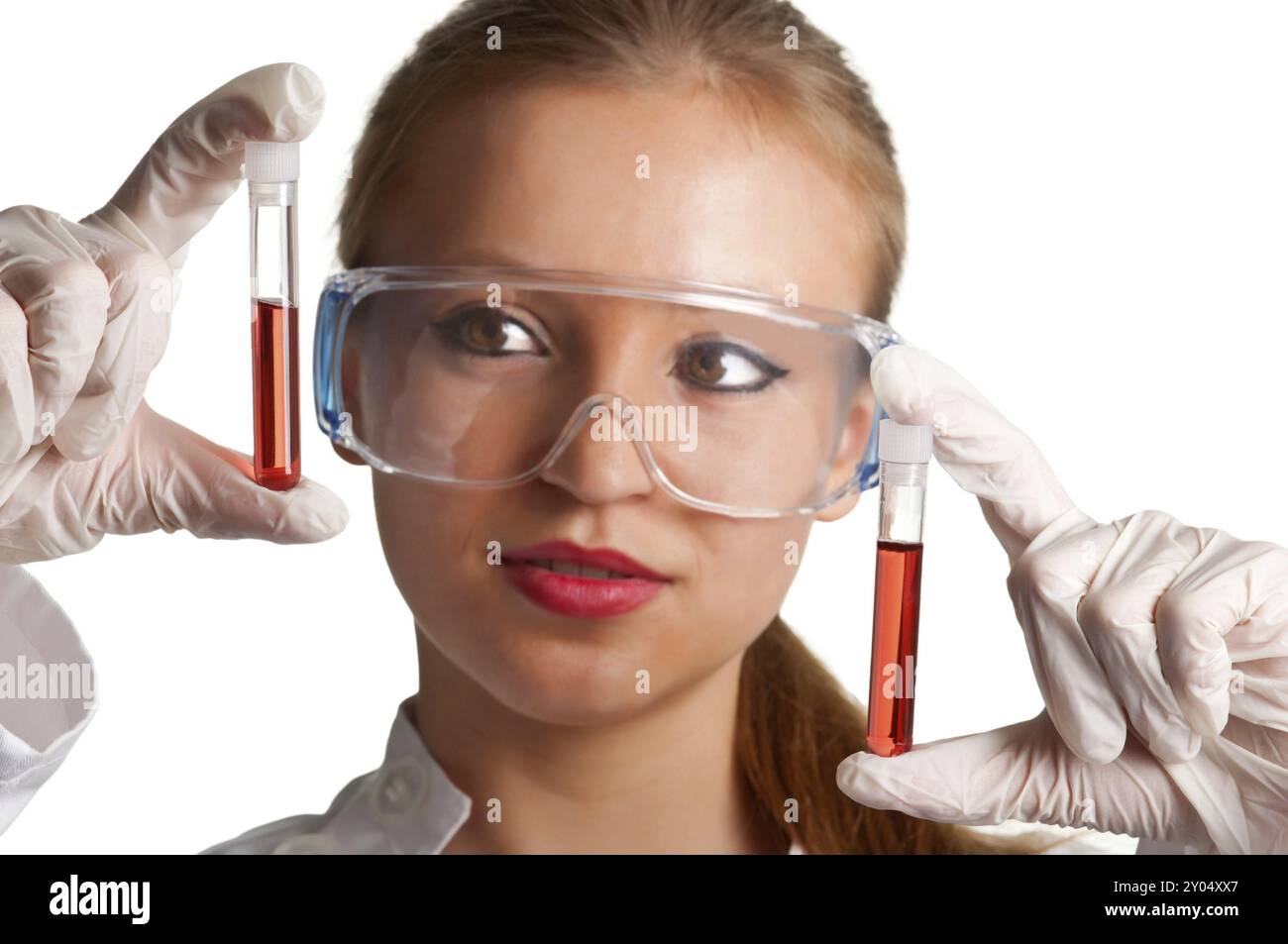 Women looking at laboratory test tubes Stock Photo - Alamy