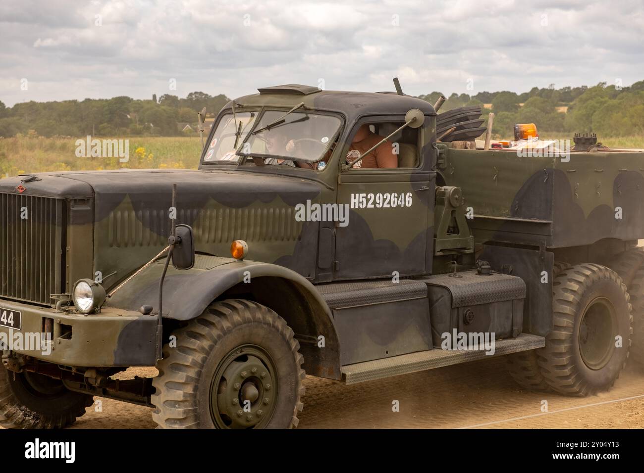 Off road military truck driving around a dust track at a World War Two ...