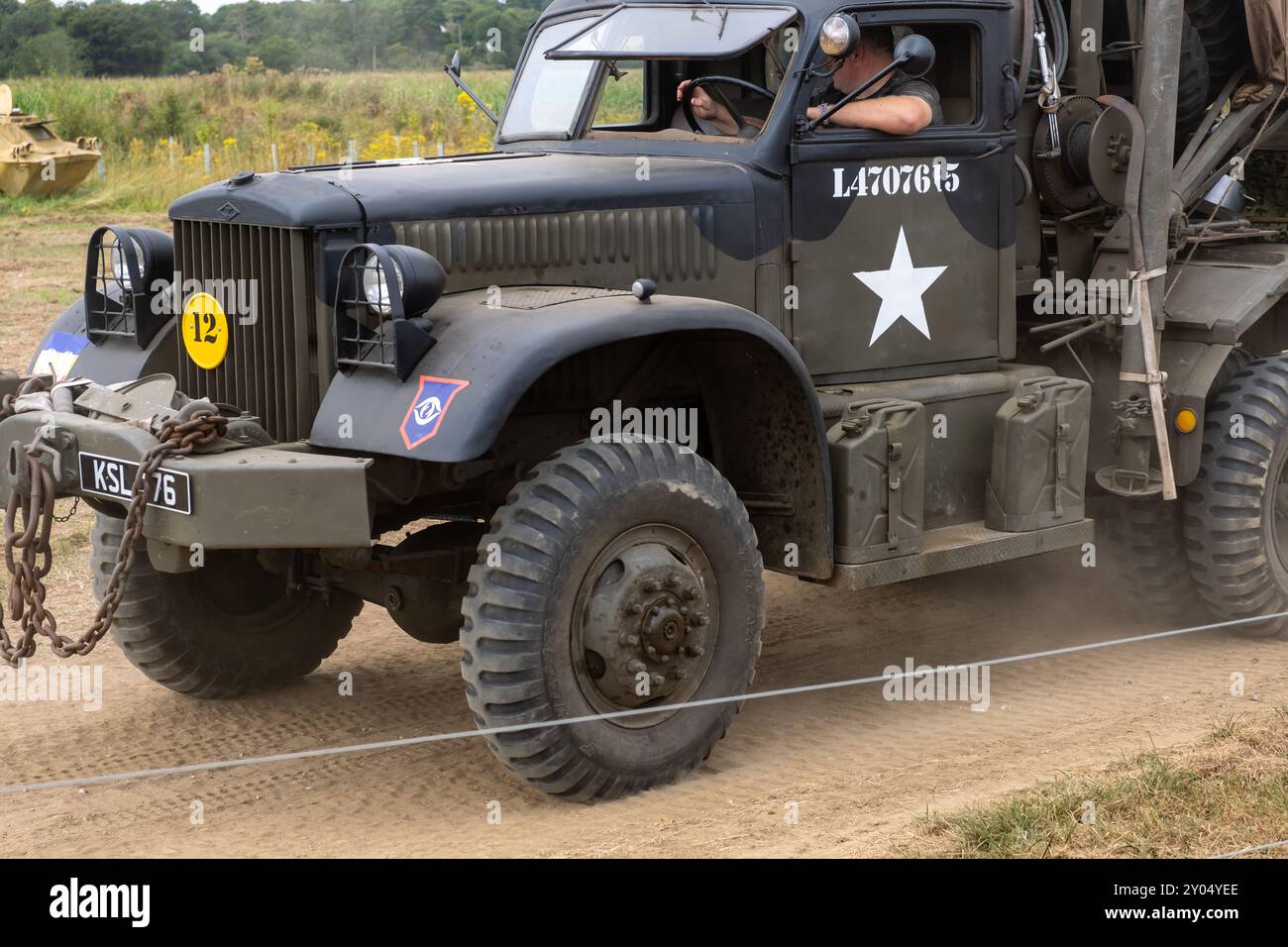 Off road military truck driving around a dust track at a World War Two ...