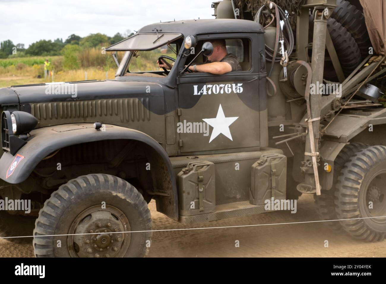Off road military truck driving around a dust track at a World War Two ...