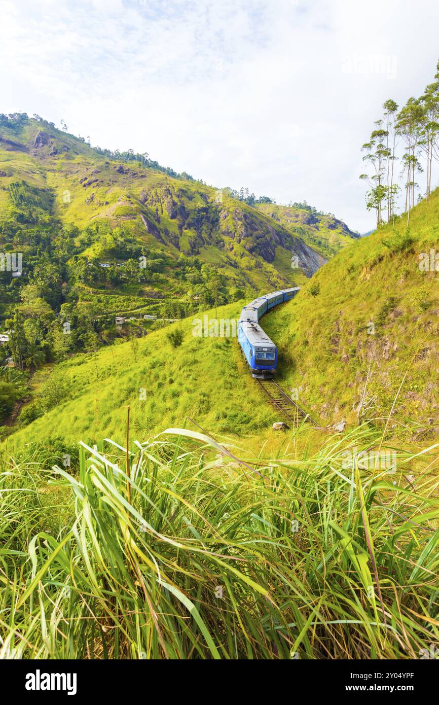 Passenger train approaching famous Demodara Loop, a curved circular ...