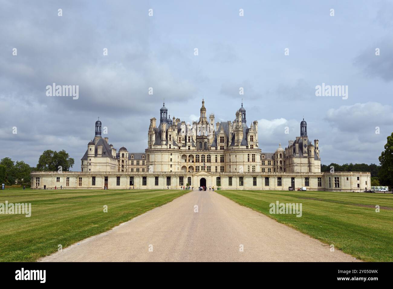 Large historic castle with many towers and decorations, situated along ...