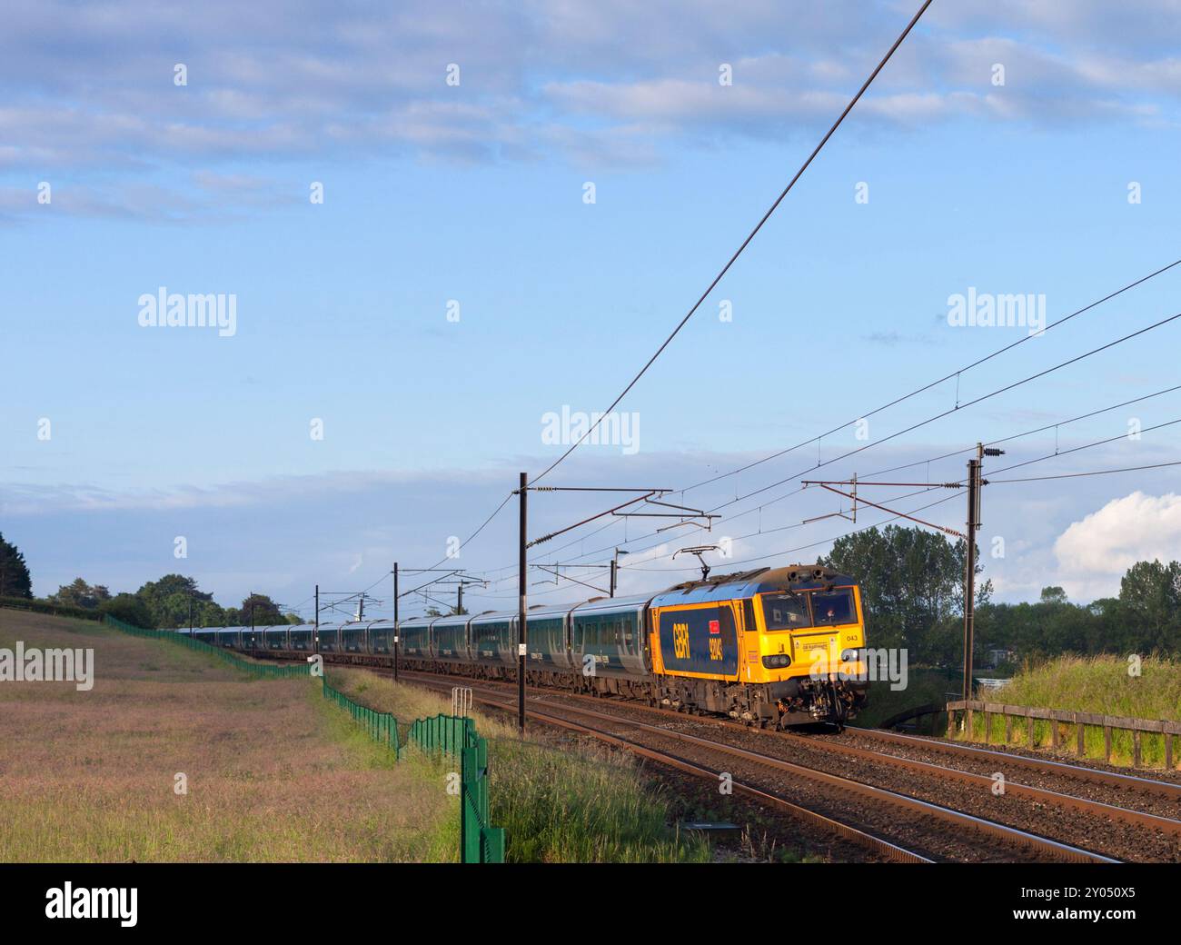 The northbound Lowland Caledonian sleeper on the west coast mainline in Lancashire hauled by a ...