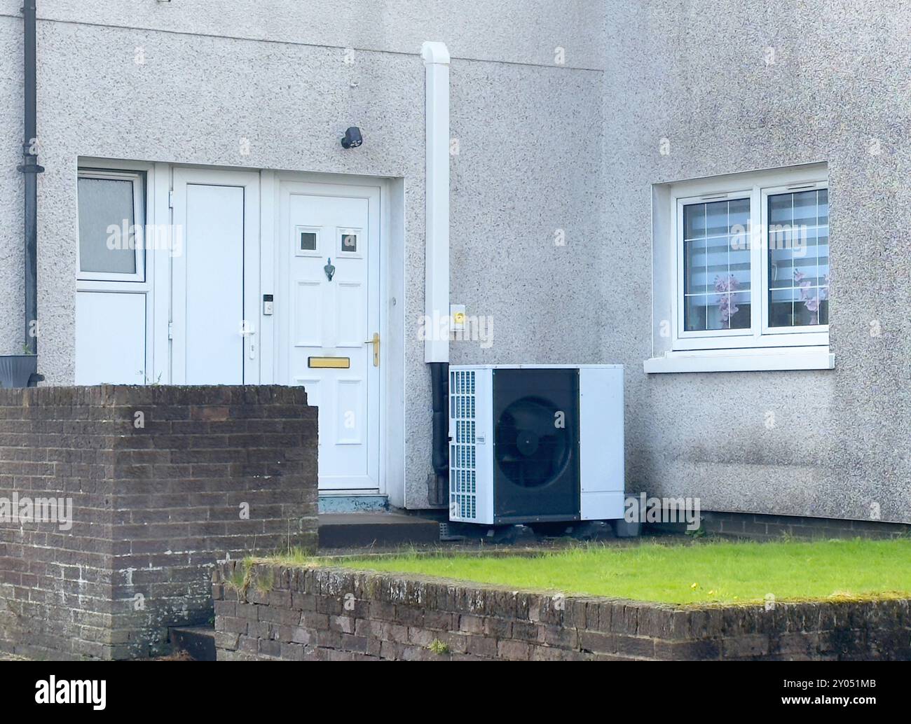 Heat pump condenser unit for heating and cooling at residential house ...