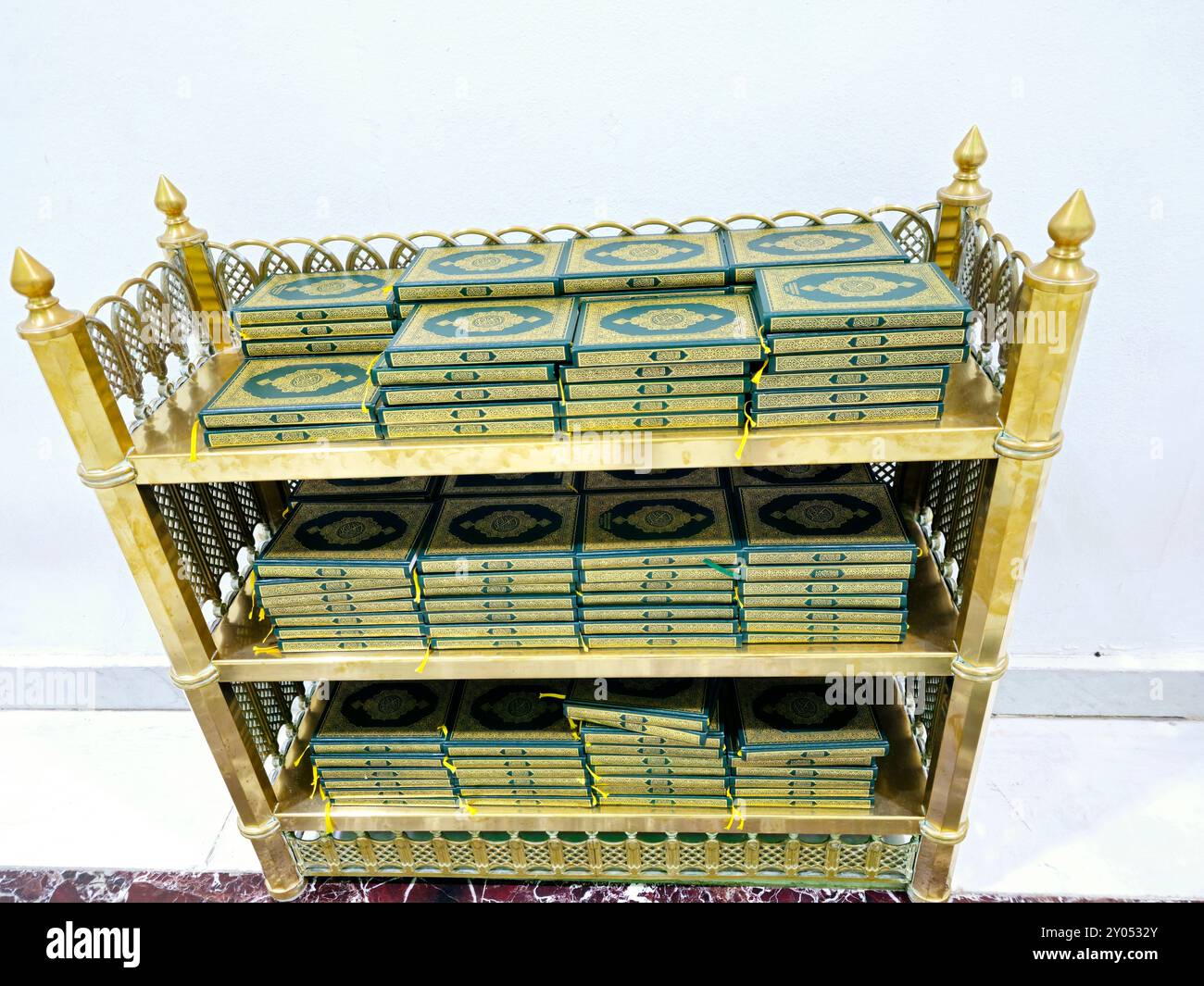 Translation of the Arabic text (Holy Quran), Stacks of holy Quran book ...