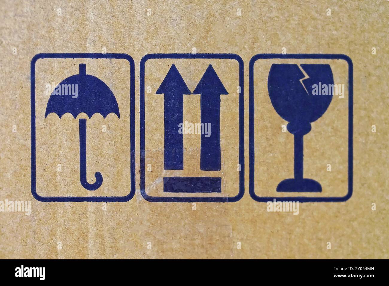 Handle with care at cardboard package box Stock Photo - Alamy