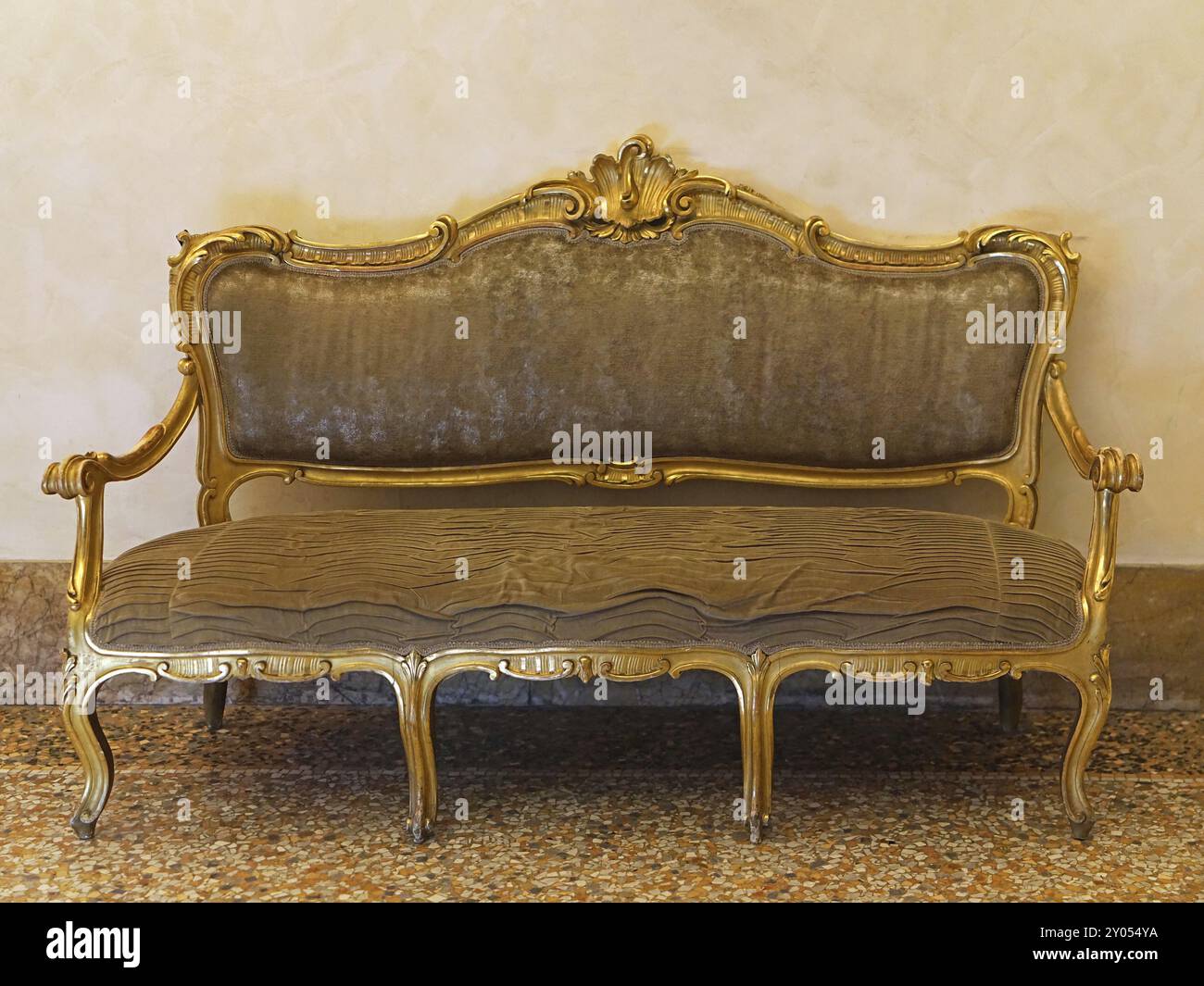 Classic style golden sofa with patina Stock Photo - Alamy