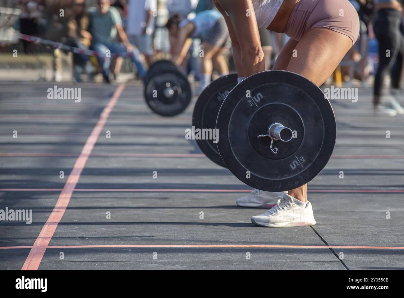 Part of a photo of an intense moment as the athlete prepares to lift ...