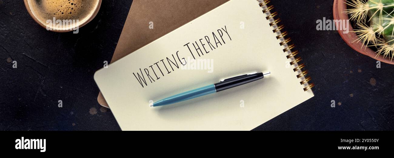 Writing Therapy. Notebook with a pen, coffee, and a plant, overhead ...