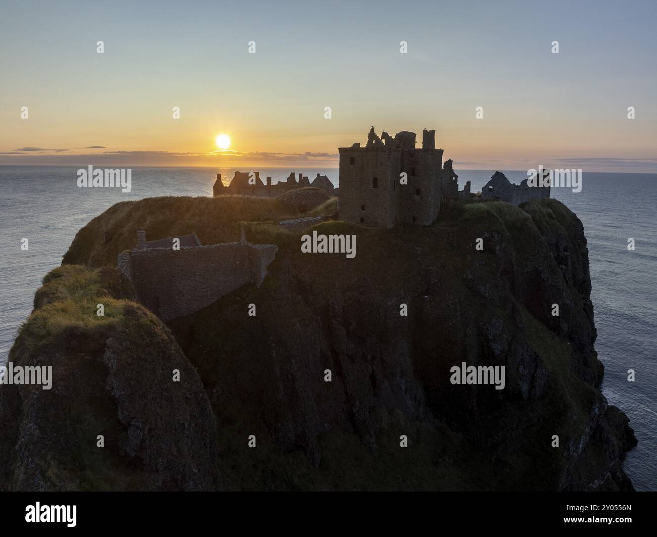 Dunnottar Castle, castle ruins at sunrise on the cliffs, drone shot ...