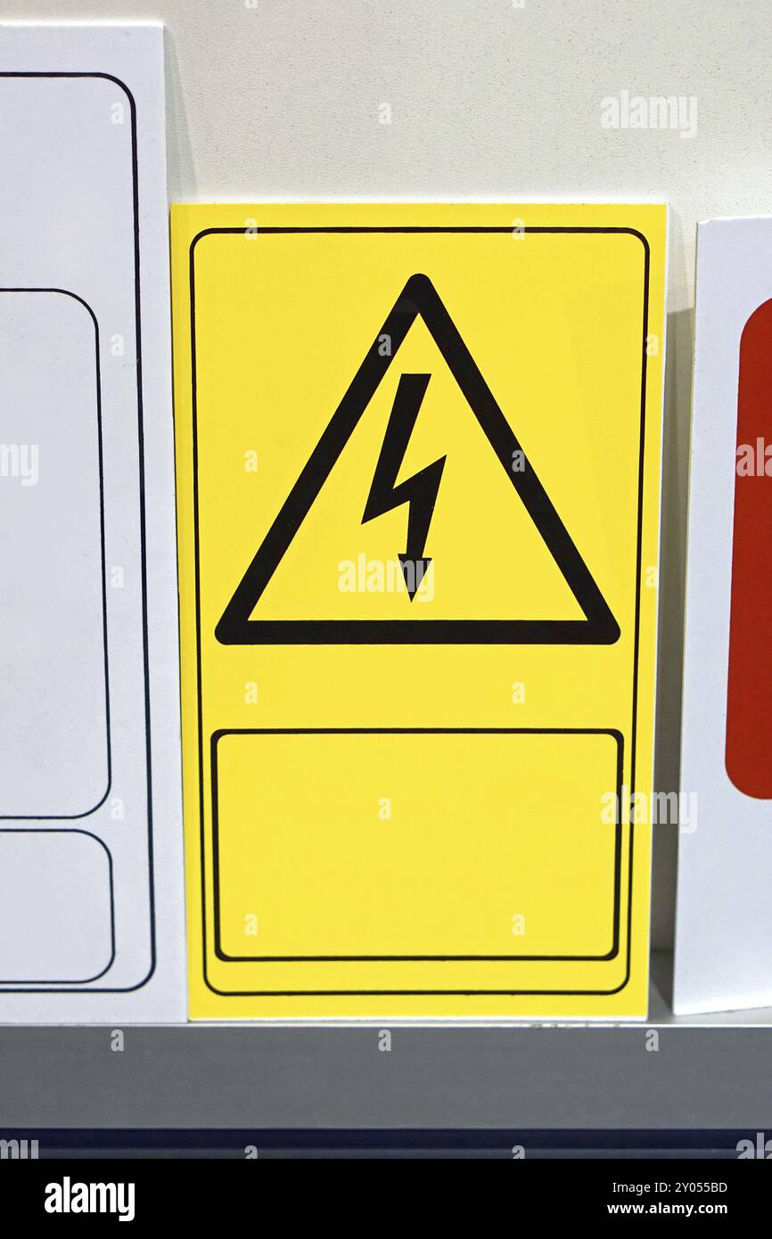 Yellow electric shock warning sign Stock Photo - Alamy