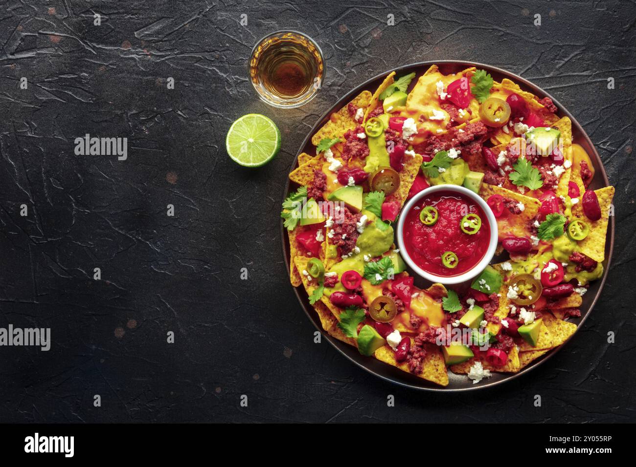 Loaded nachos. Mexican nacho chips with beef, overhead flat lay shot ...