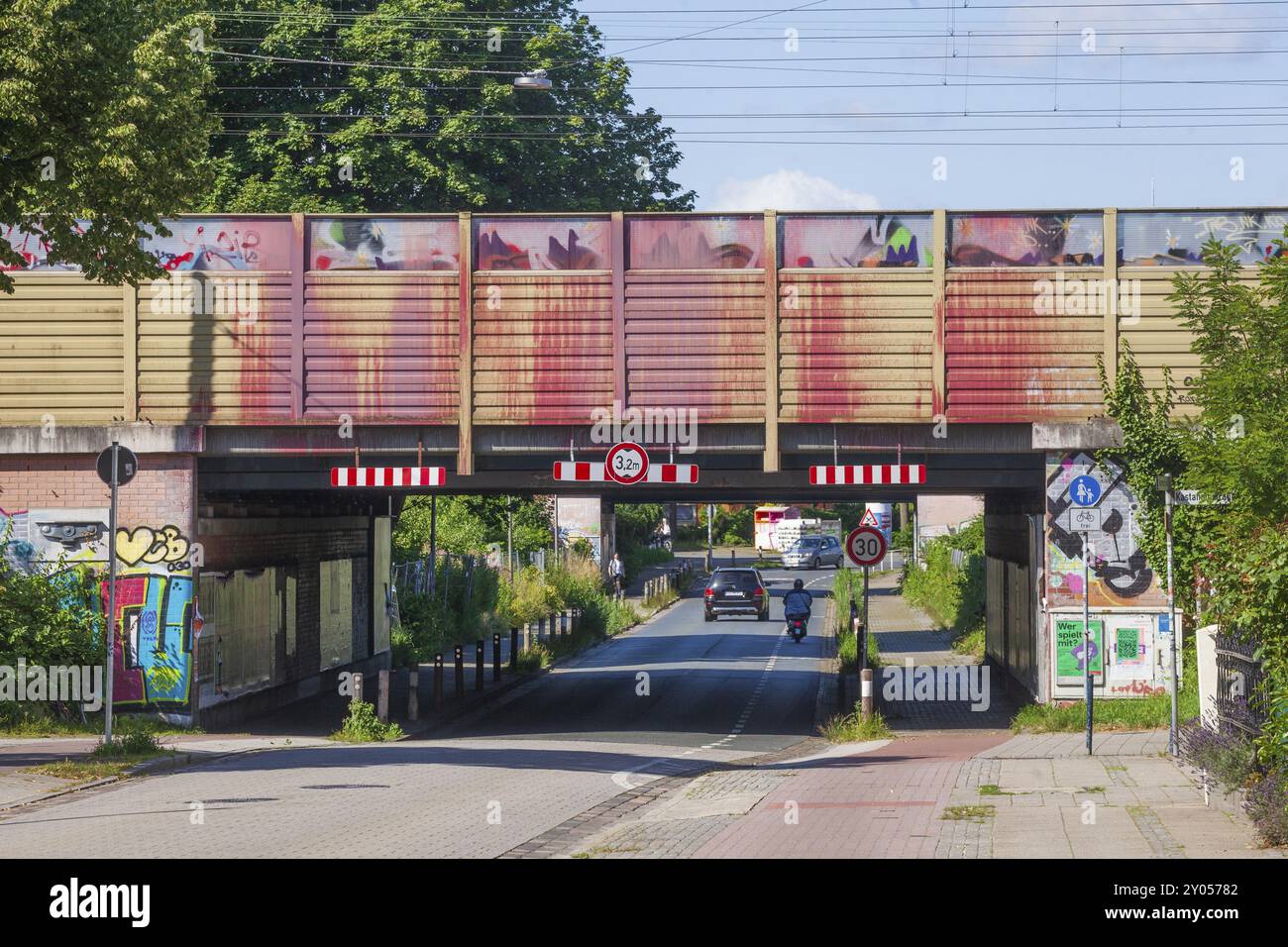 Colourfully painted railway bridge with noise barrier and road, Bremen ...