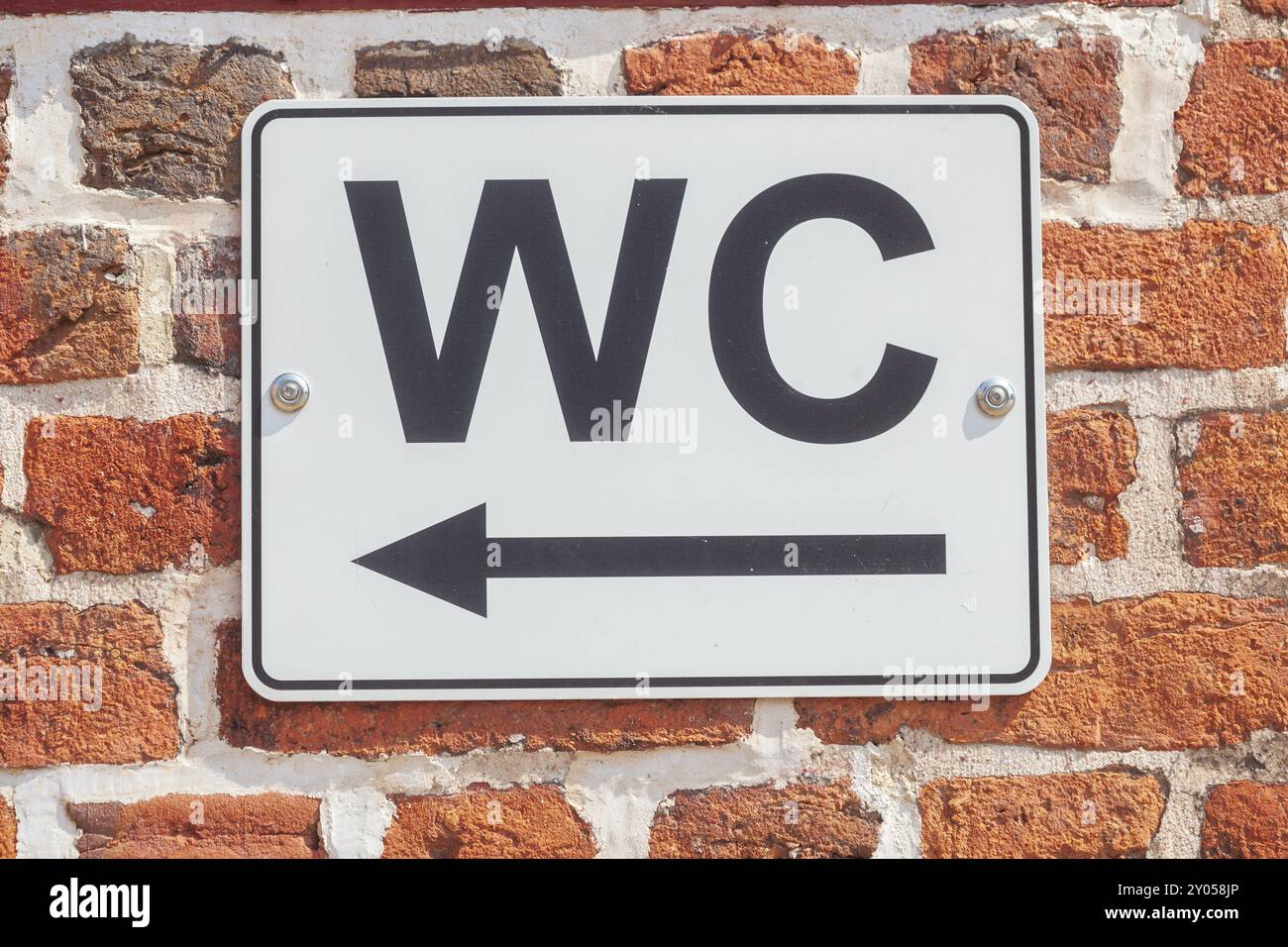 Sign WC, public toilet on a brick wall, Germany, Europe Stock Photo - Alamy