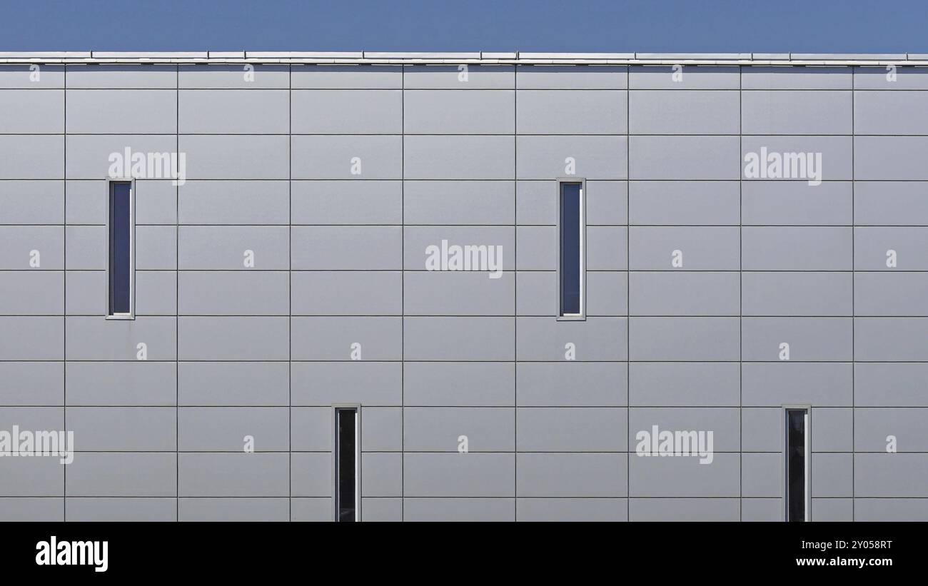 Grey metal panels at commercial building exterior Stock Photo - Alamy