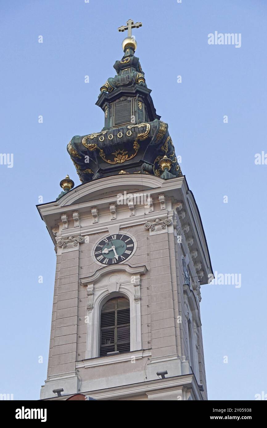 Church tower with clock and cross in Novi Sad Stock Photo - Alamy