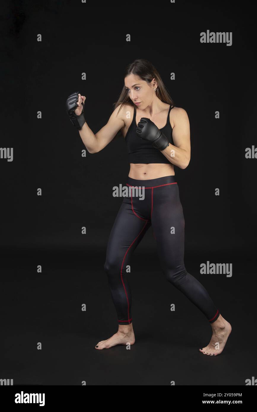 Caucasian MMA fighter in a defensive stance, showing commitment and ...