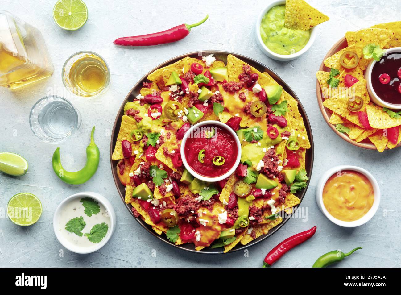 Loaded nachos. Mexican nacho chips with beef, overhead flat lay shot ...