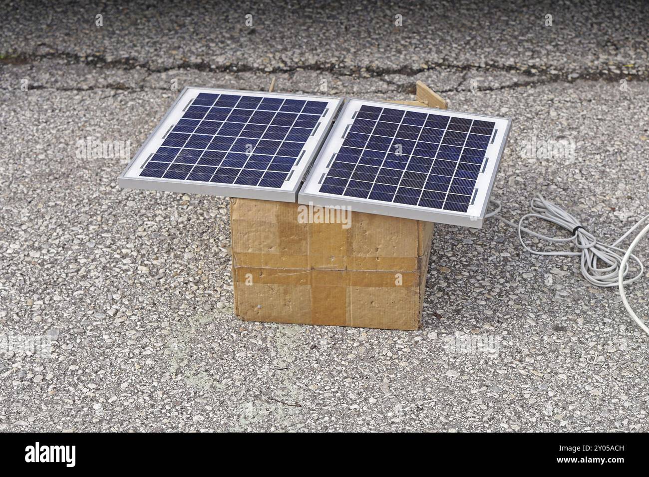 Double solar panel cells at box outside Stock Photo - Alamy
