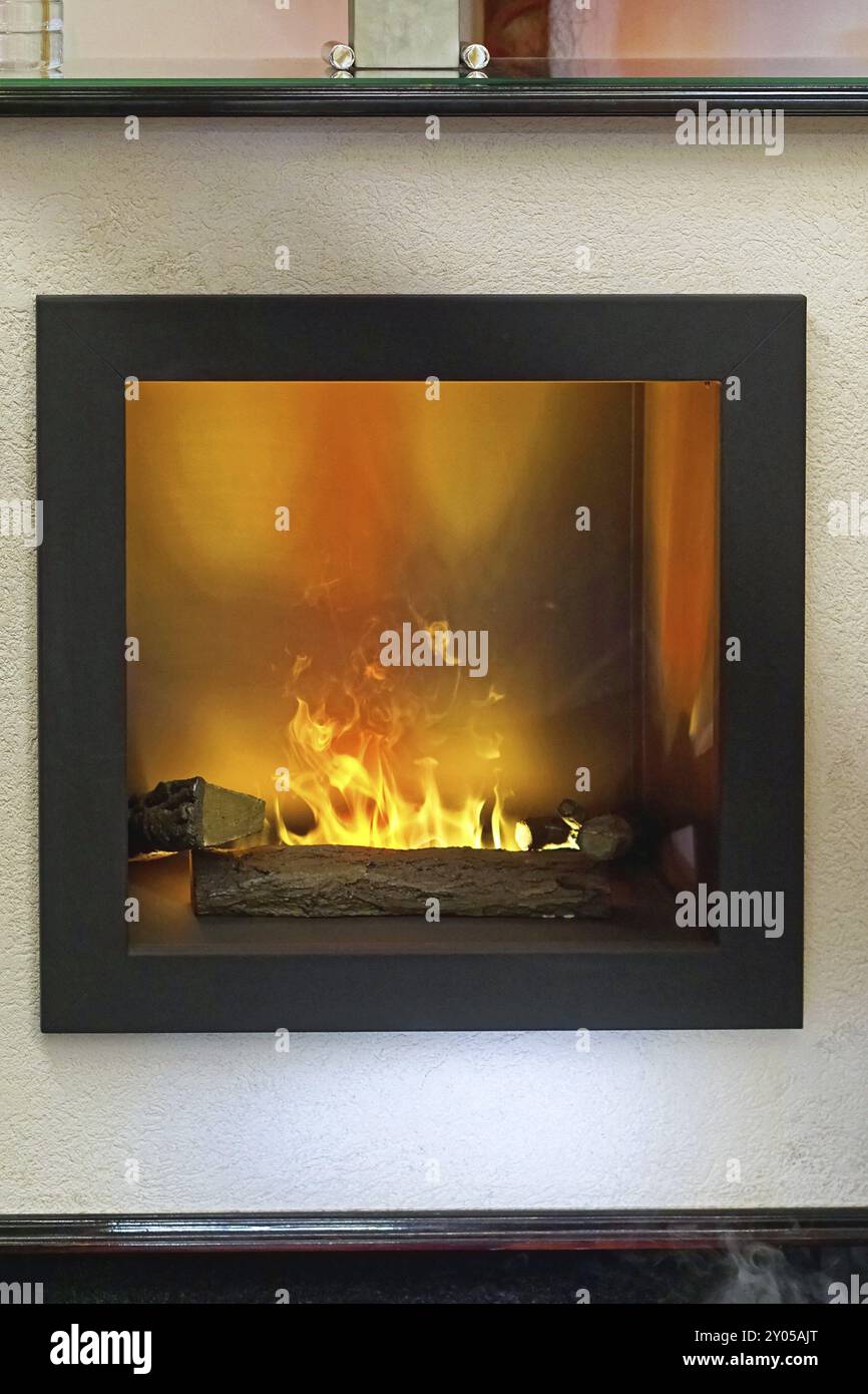 Modern square electric fireplace with led lights Stock Photo - Alamy