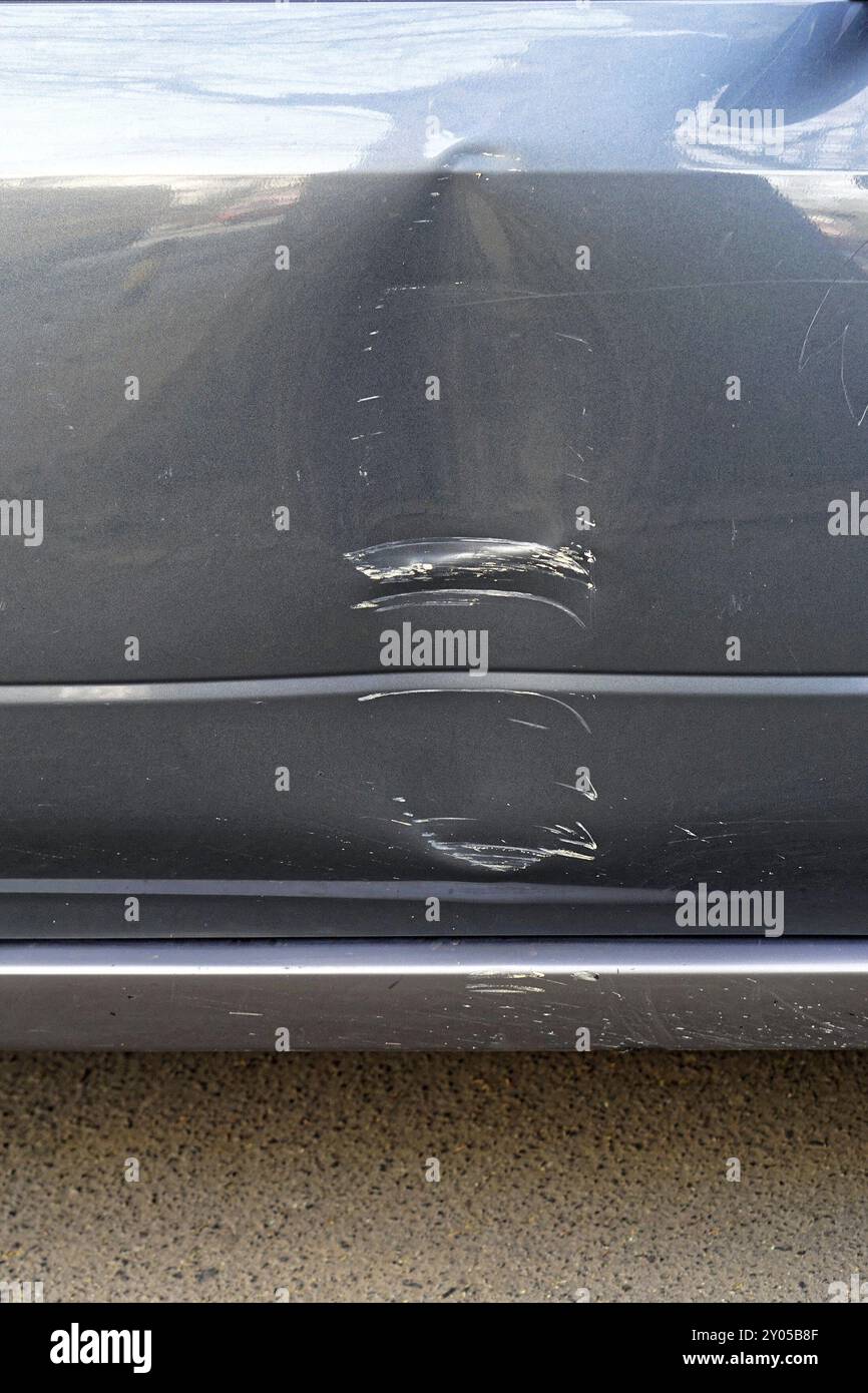 Big dent at car door damage Stock Photo - Alamy
