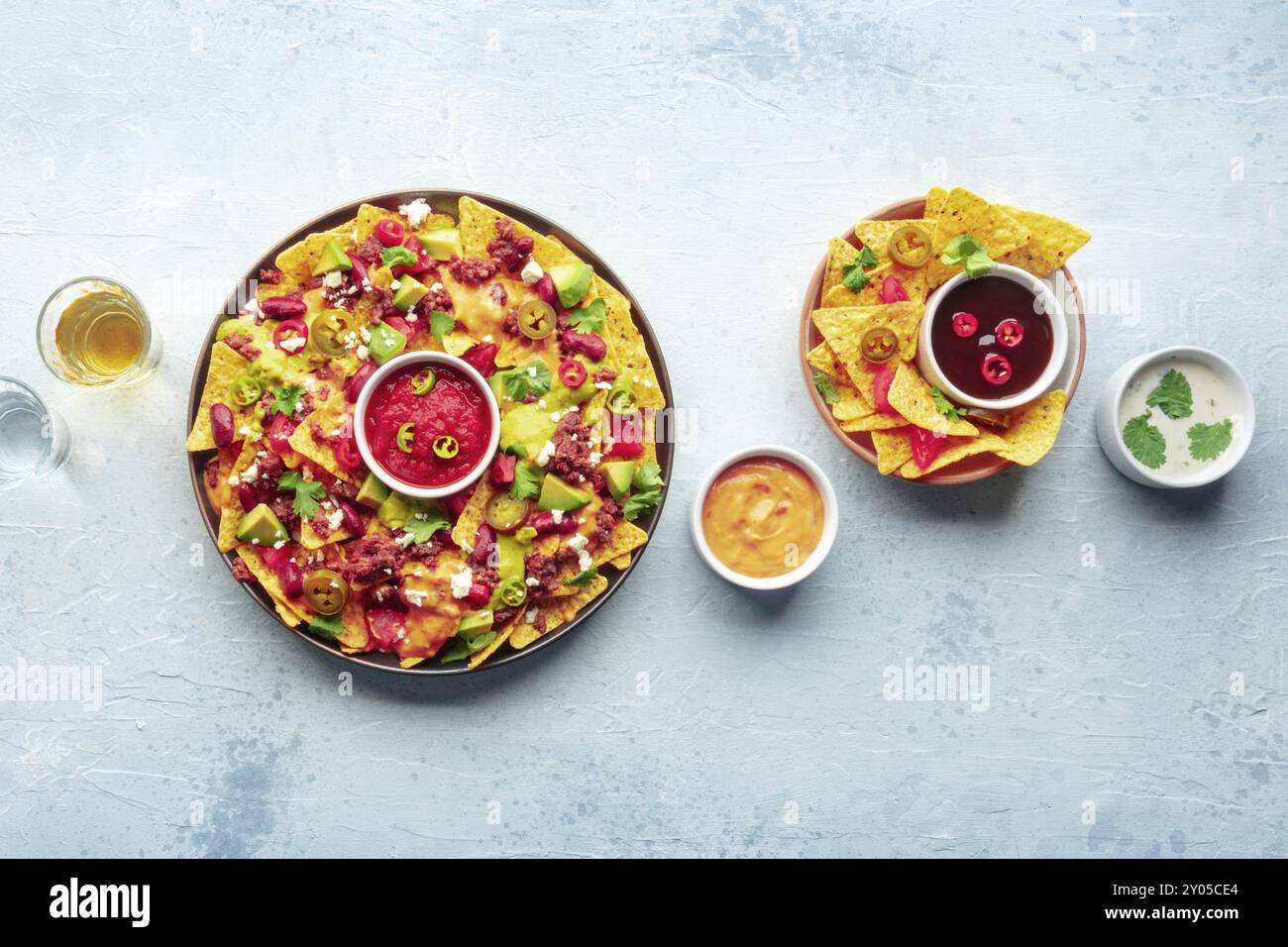 Loaded nachos. Mexican nacho chips with beef, overhead flat lay shot ...