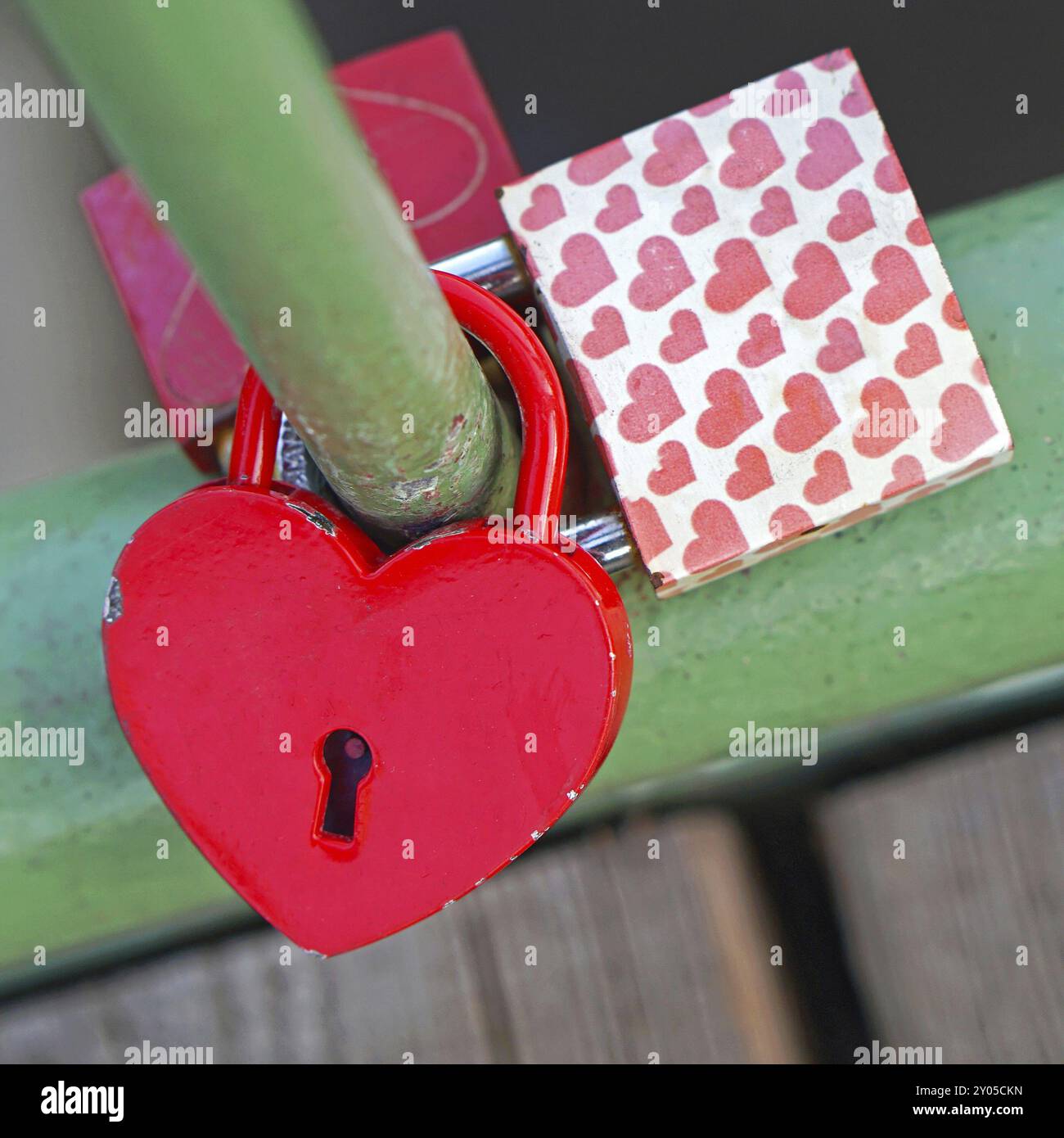 Love locks in shape of heart attached at bridge Stock Photo - Alamy