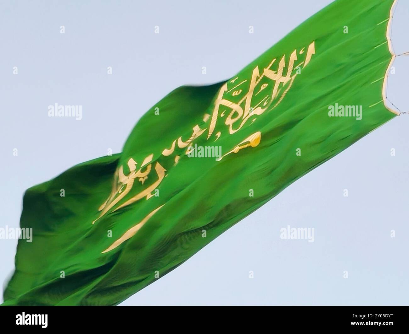 The national flag of Saudi Arabia kingdom, a green background with ...
