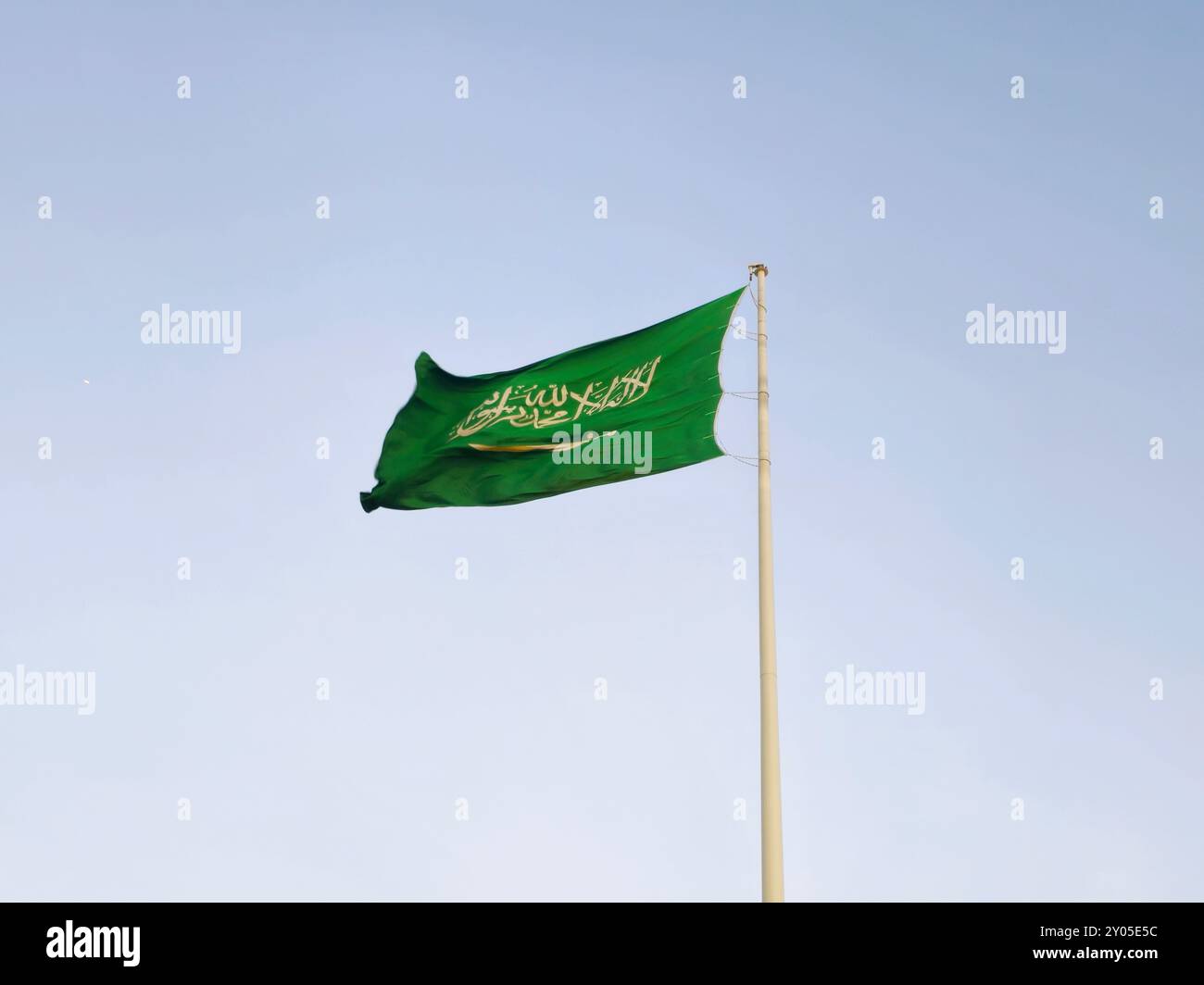 The national flag of Saudi Arabia kingdom, a green background with ...